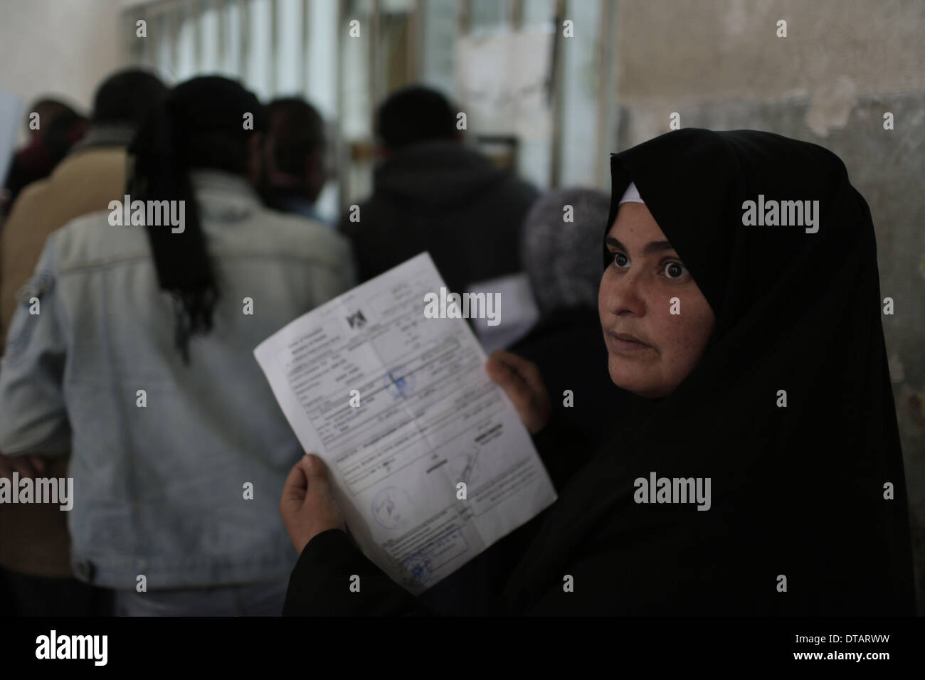 Gaza City. 13th Feb, 2014. A Palestinian patient displays her document ...