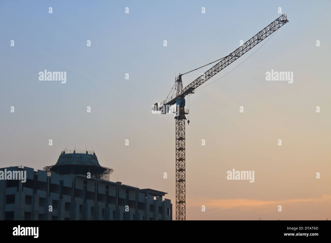 Construction site on sunset background Stock Photo - Alamy