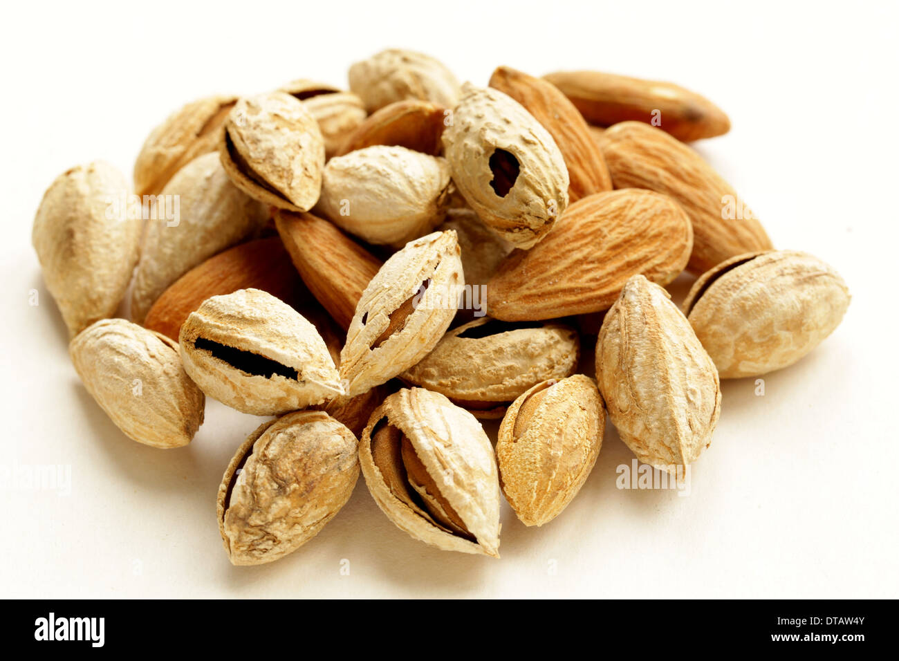 pile of peeled and inshell almonds - delicious and healthy nuts Stock ...