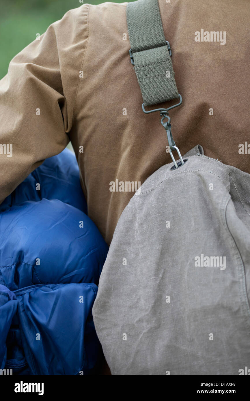 Man carrying sleeping bag and rucksack hi-res stock photography and ...