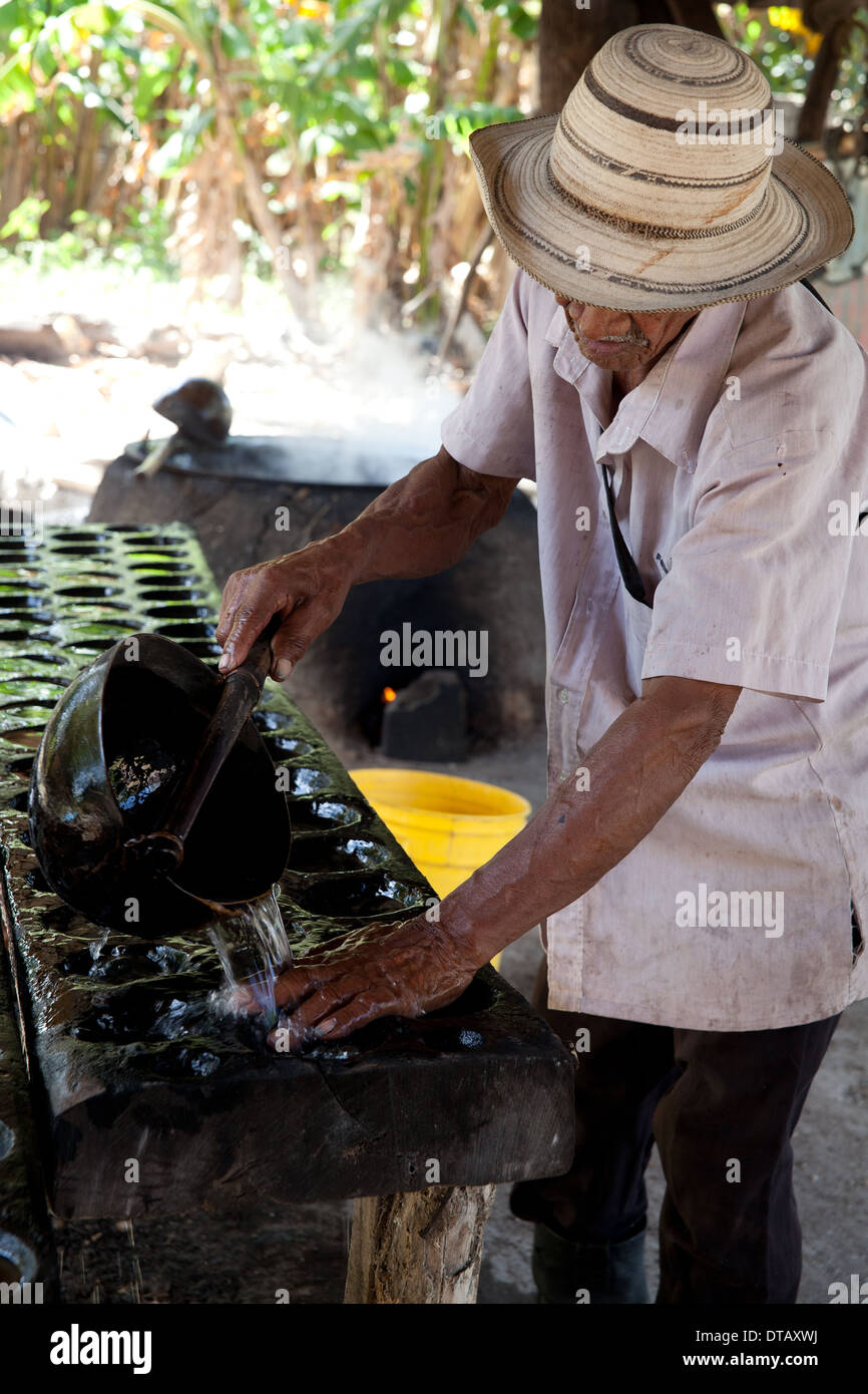 Panamanian man making Raspadura from sugarcane near Penonome in the ...
