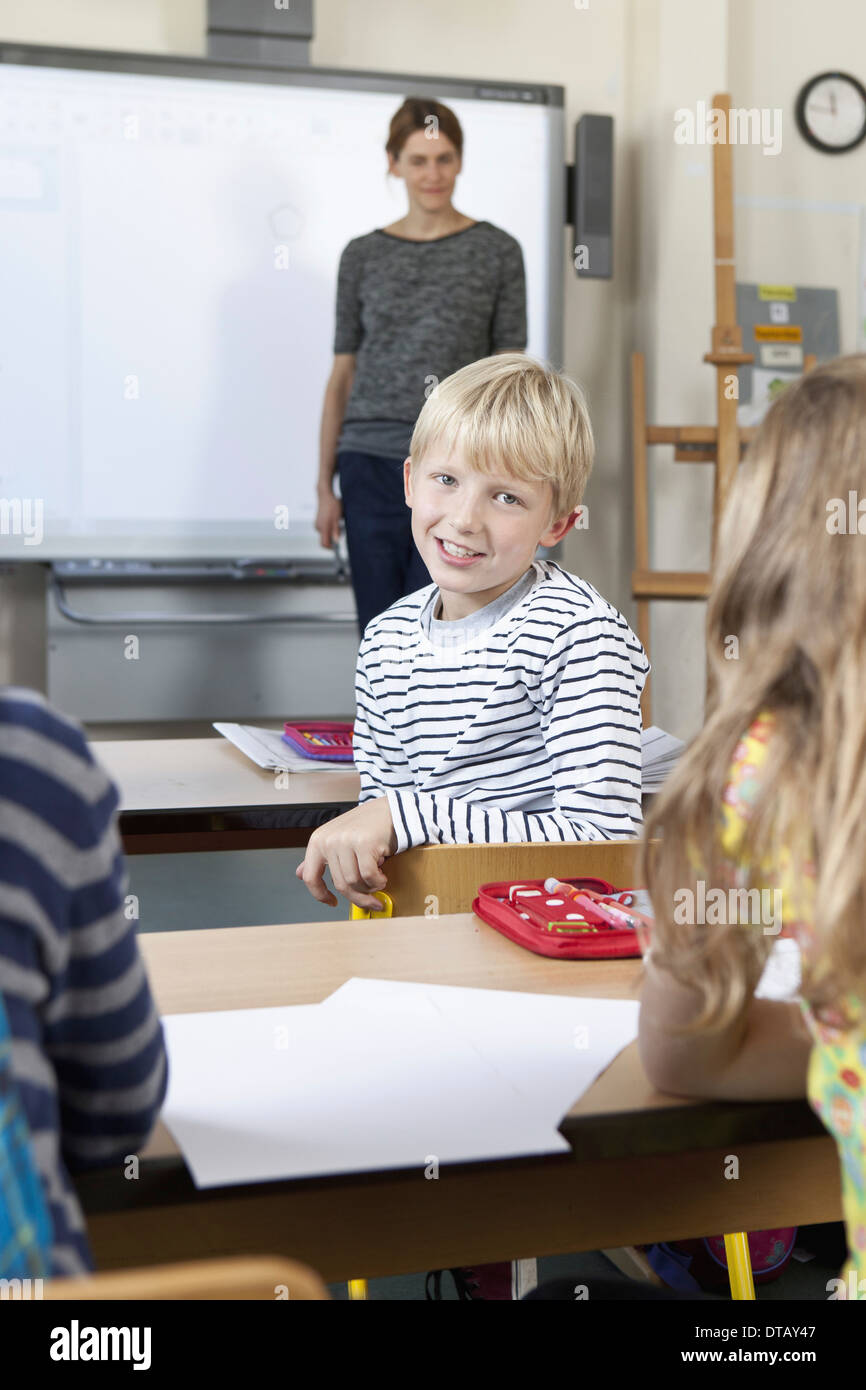 Boy and teacher in classroom hi-res stock photography and images - Alamy
