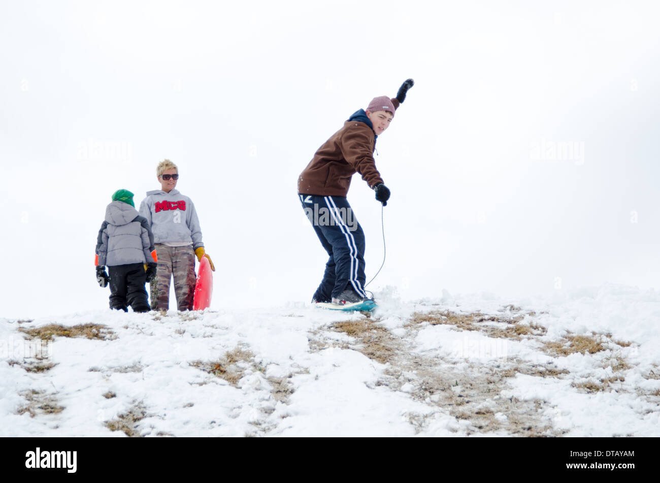 Boy with sled hi-res stock photography and images - Alamy