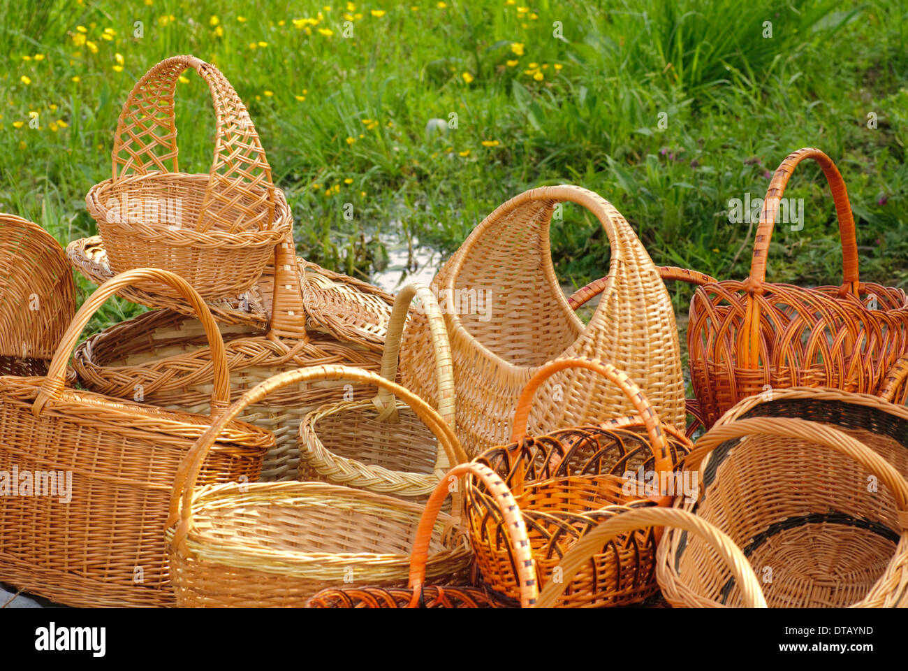 Basketry market on nature. Green field background Stock Photo - Alamy