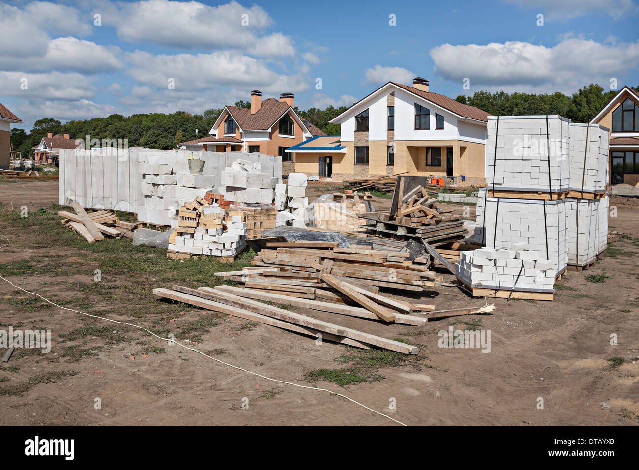 Construction material in front of house Stock Photo - Alamy