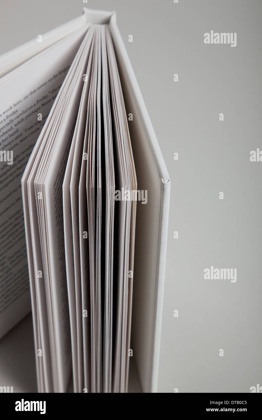 Open book on white background, close-up Stock Photo - Alamy