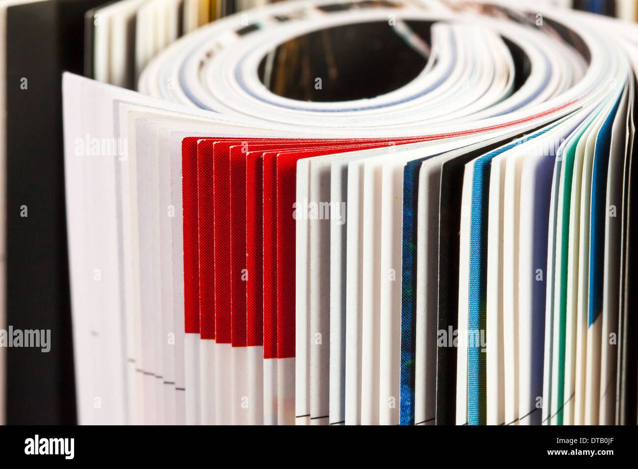 Stack of color magazines on white background Stock Photo - Alamy