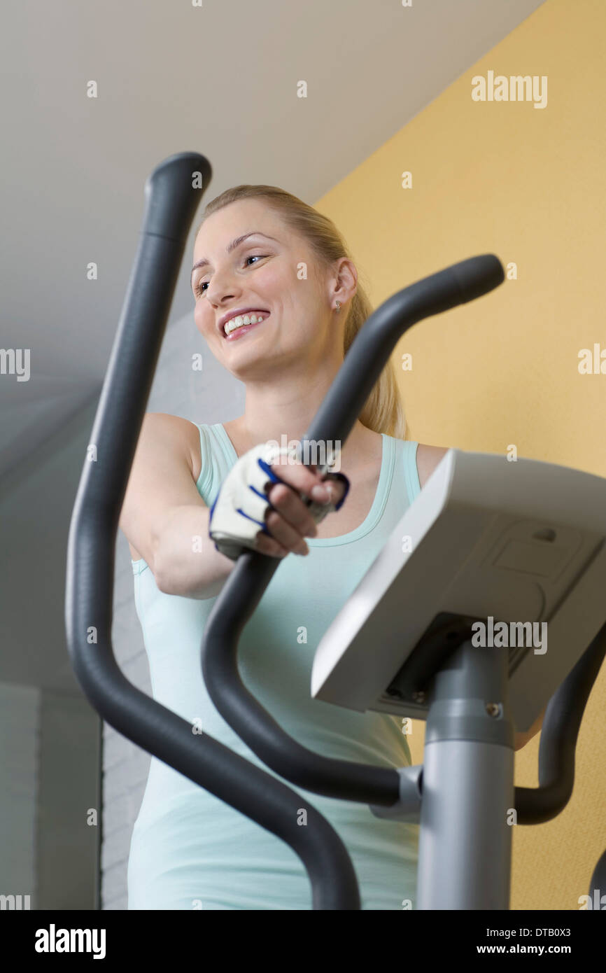 Young woman on bike gym hi-res stock photography and images - Alamy