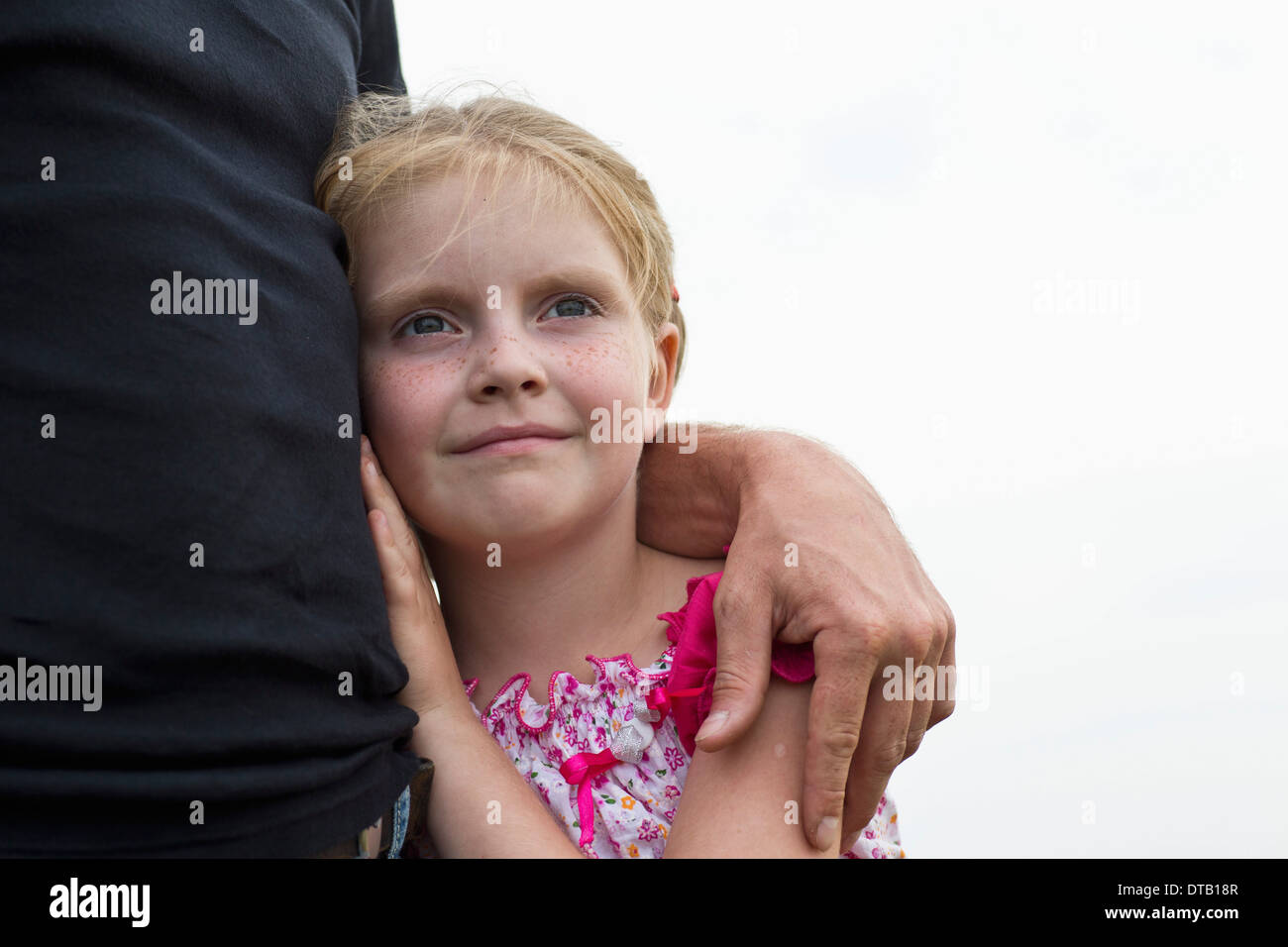 Father with daughter looking away Stock Photo - Alamy