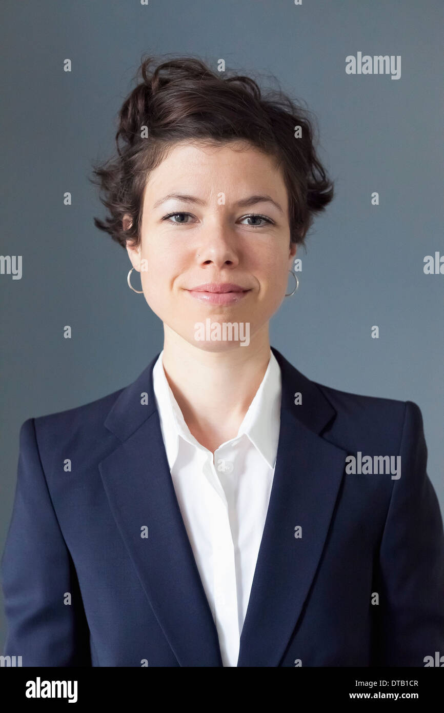 Mid adult businesswoman smiling hi-res stock photography and images - Alamy