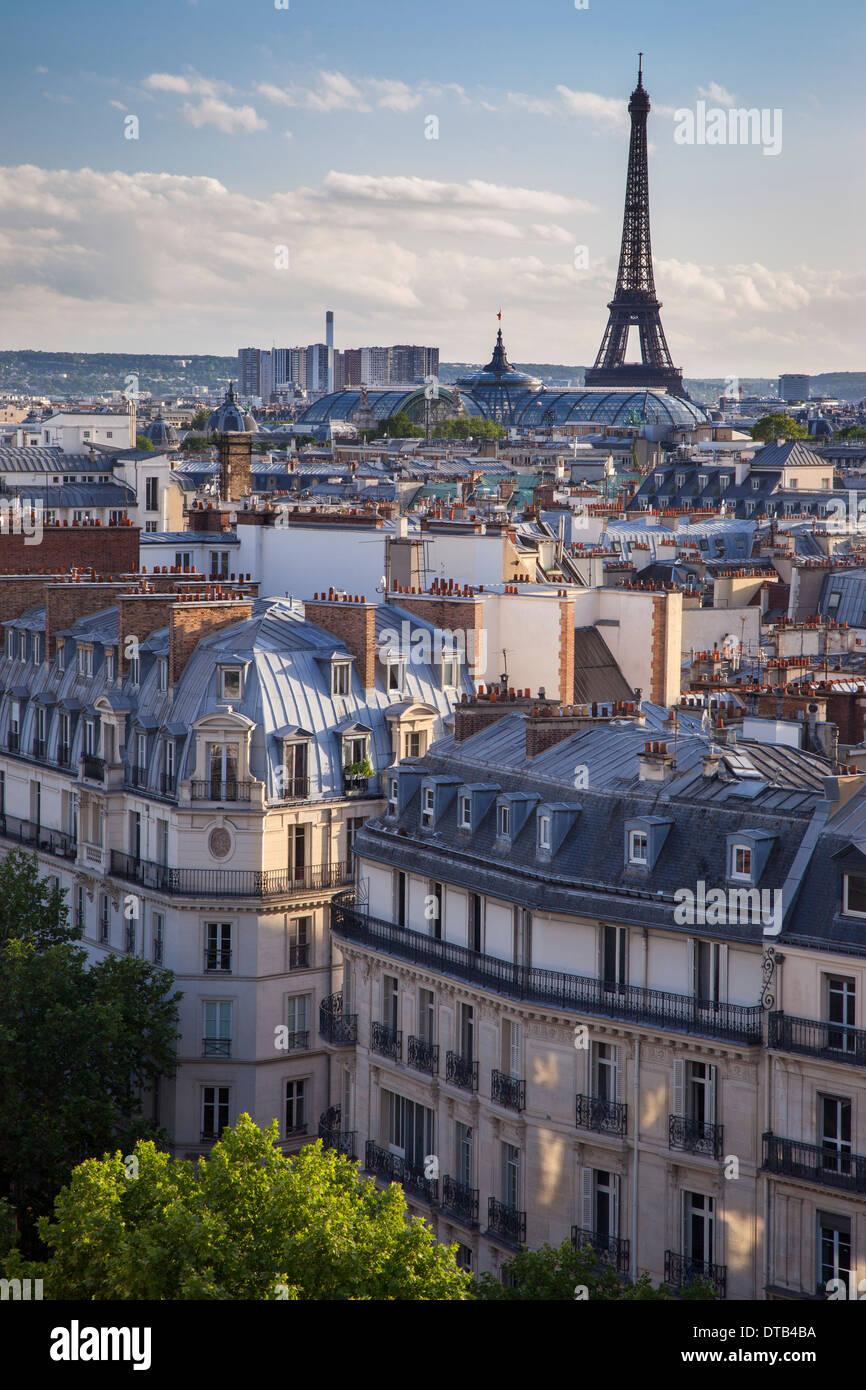 Evening sunlight over the buildings of Paris France with the Eiffel ...