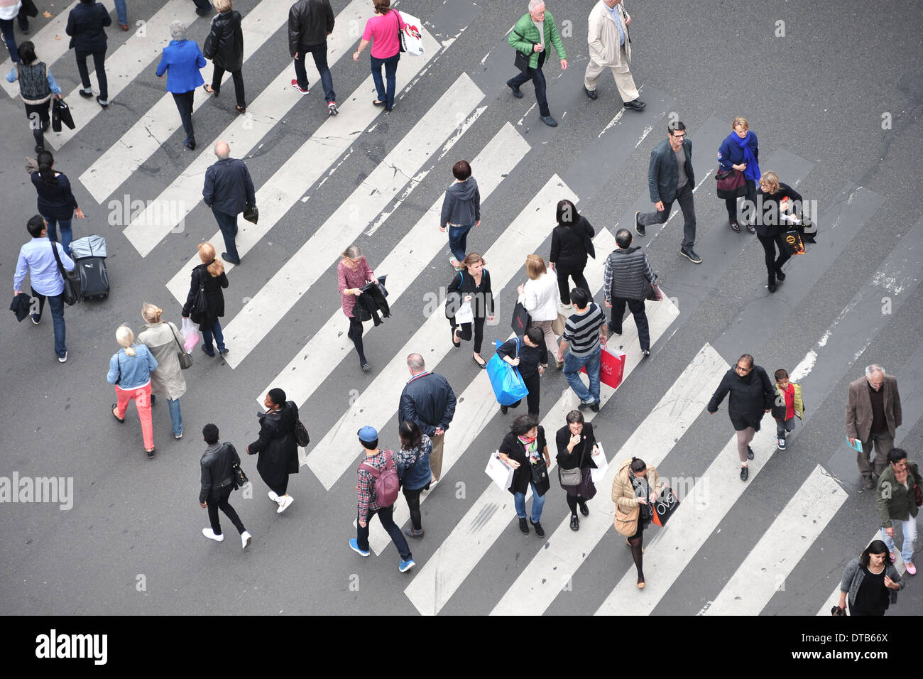 Paris, France, pedestrians cross the Boulevard Haussmann at a crosswalk ...