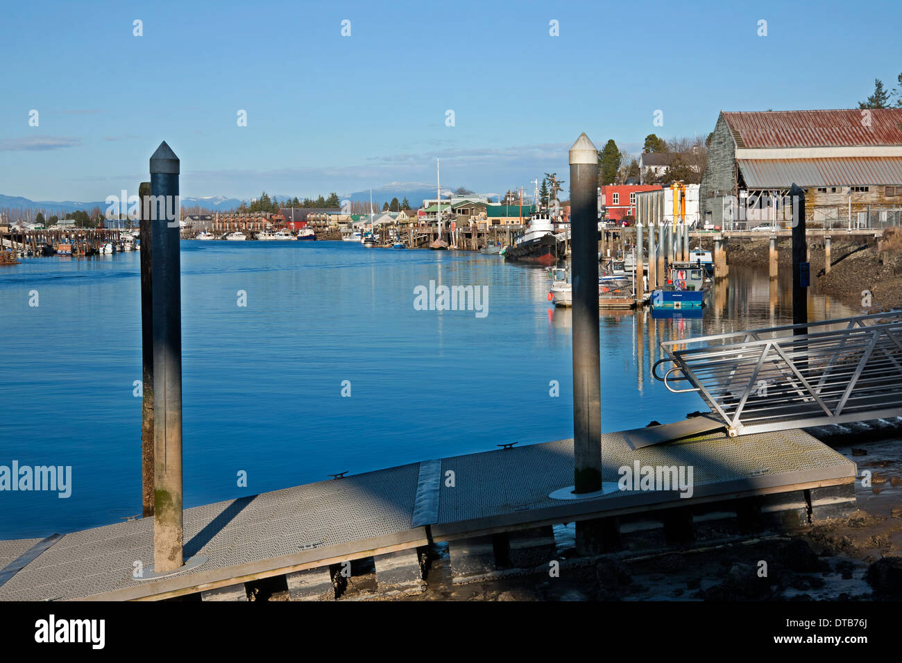 WASHINGTON - Dock on the Swinomish Channel and the town of La Conner ...