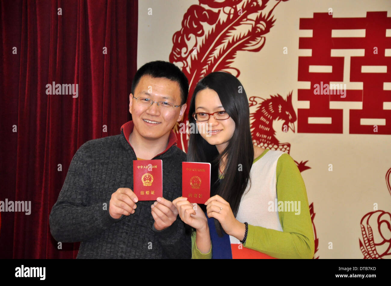 Beijing, China. 13th Feb, 2013. Newlyweds show their marriage ...