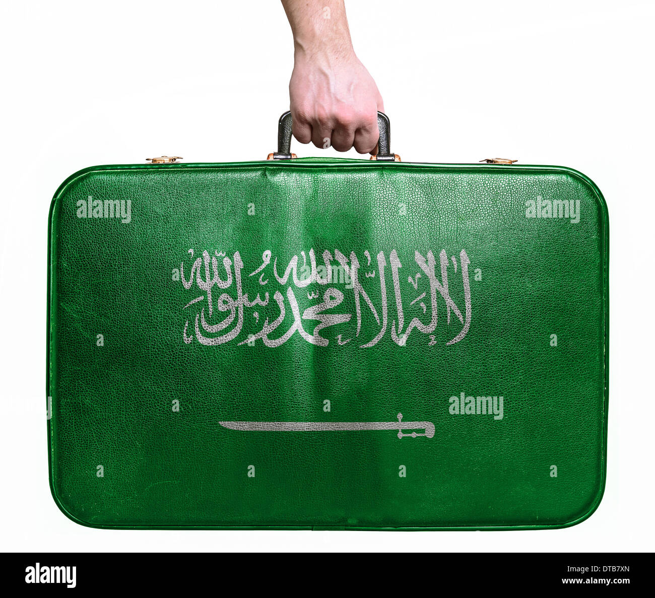 Tourist hand holding vintage leather travel bag with flag of Saudi ...