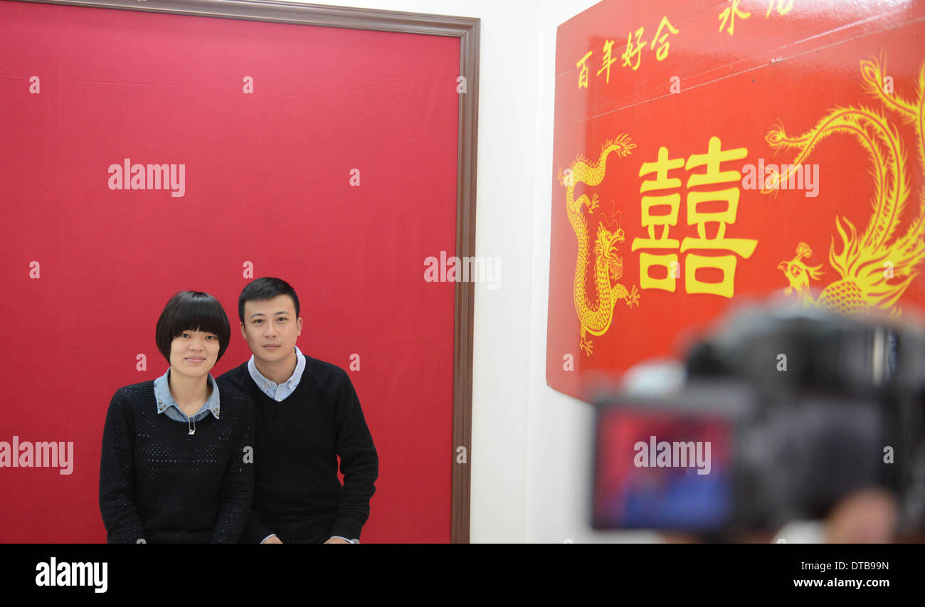 Hezhou, China's Guangxi Zhuang Autonomous Region. 14th Feb, 2014. Newlyweds pose for photos at a ...