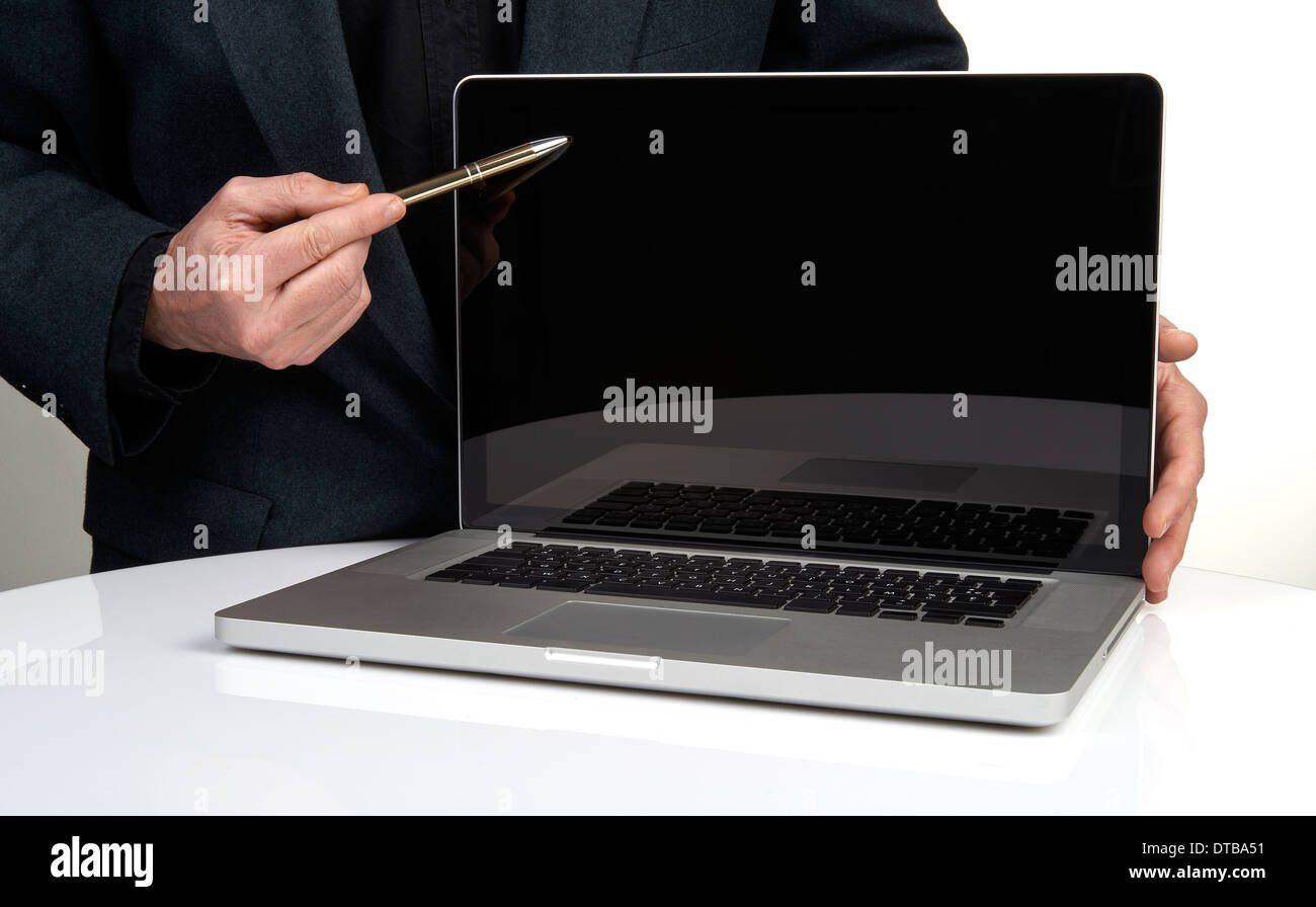 Men with laptop. businessman pointing laptop with a pen Stock Photo - Alamy