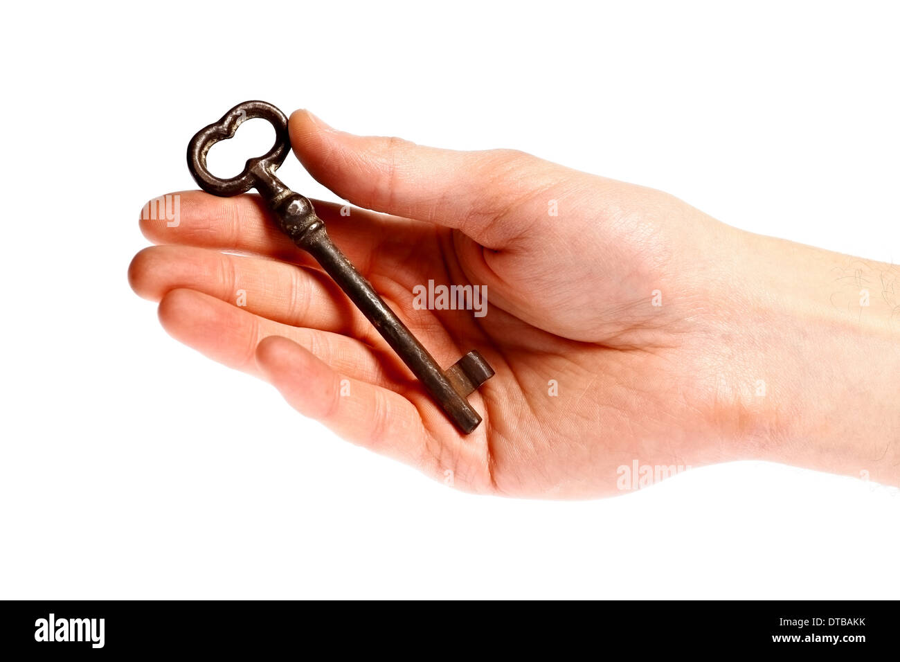Hand holding an old rusty key isolated on white background Stock Photo ...