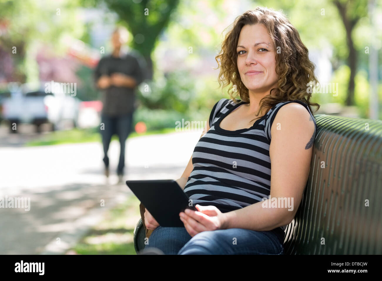 Confident Student Relaxing At University Campus Stock Photo - Alamy
