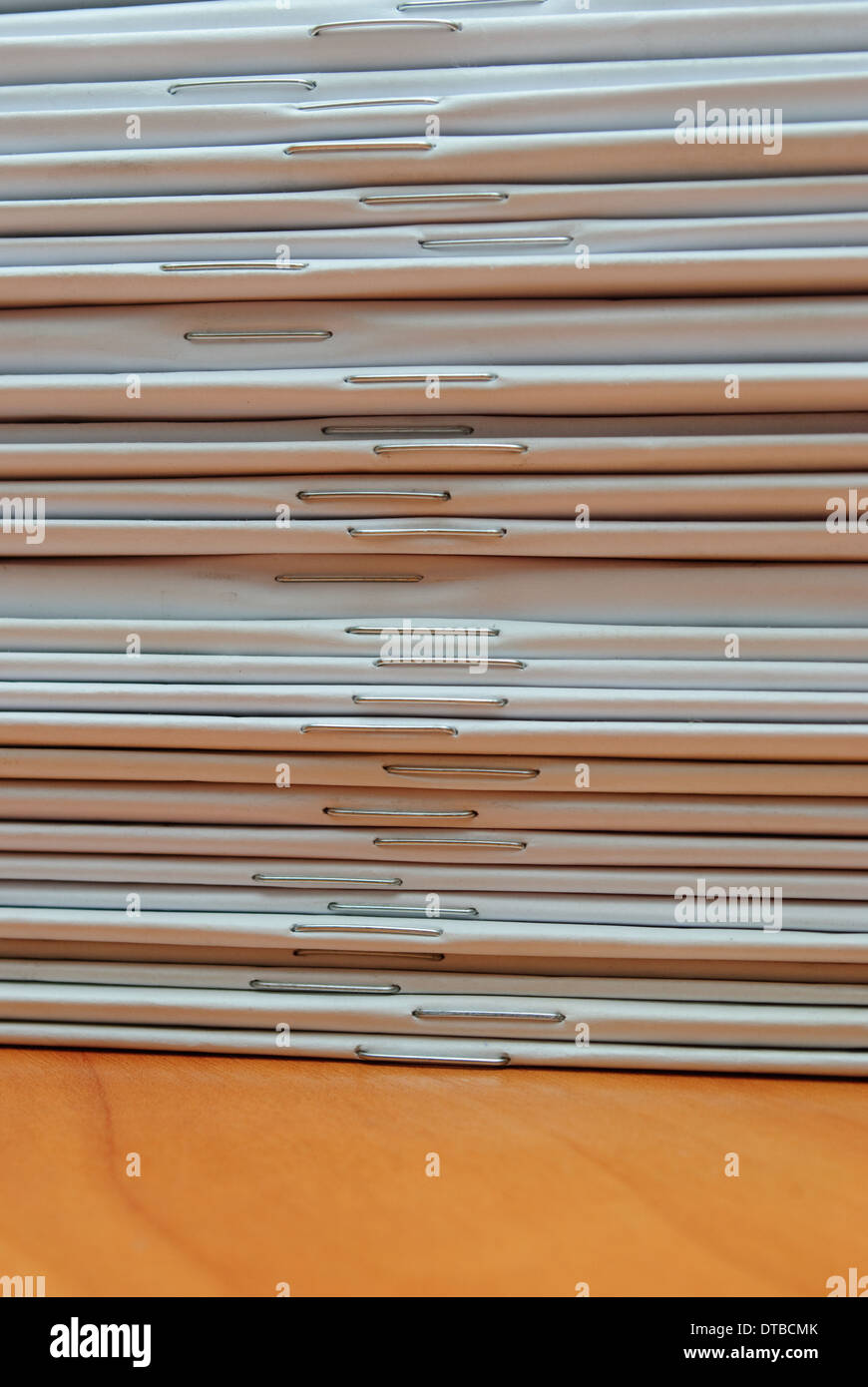 Stack of white journals in office desktop. Shallow deep of field Stock ...