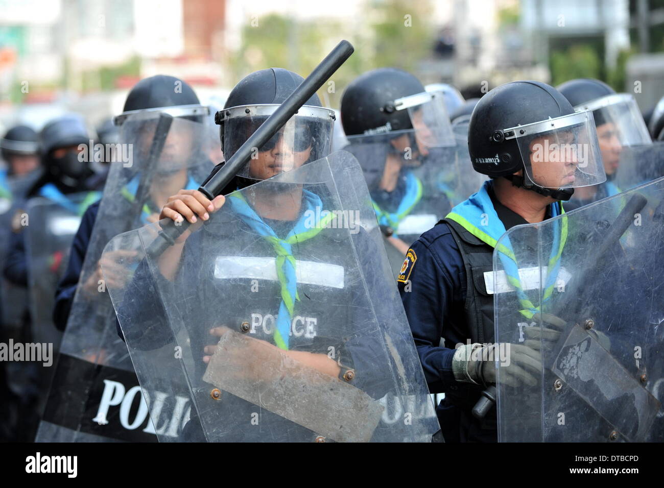 Bangkok, Thailand. 14th Feb, 2014. Thai riot police officers holding ...