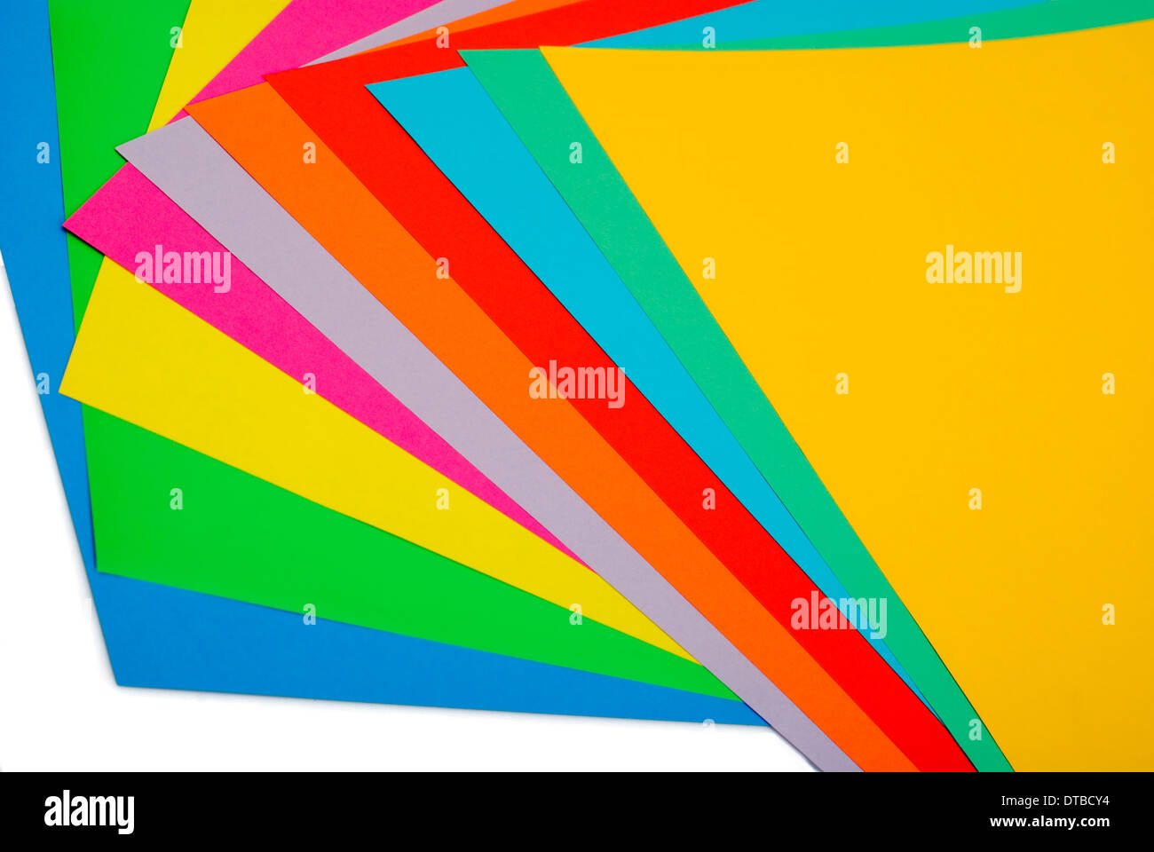 various color paper stack like a rainbow isolated on white Stock Photo ...