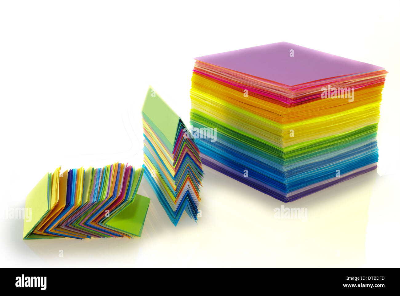 various color paper stacks isolated on white Stock Photo - Alamy