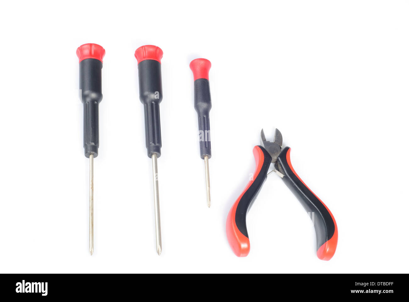 Screwdrivers and cutter isolated on white background Stock Photo - Alamy