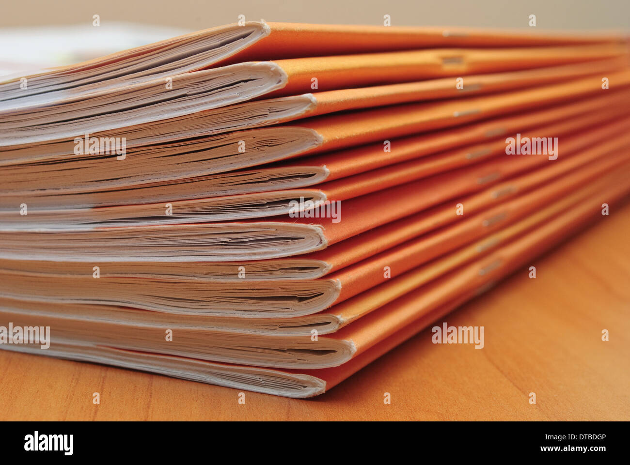 Stack of journals on office desktop. Shallow deep of field Stock Photo ...