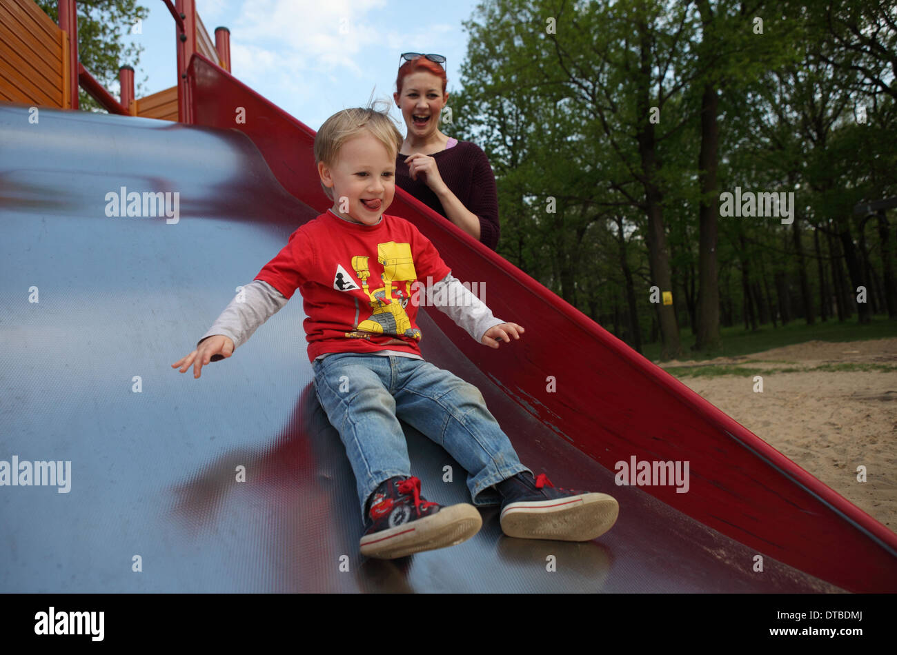 Sliding down the slide hi-res stock photography and images - Alamy