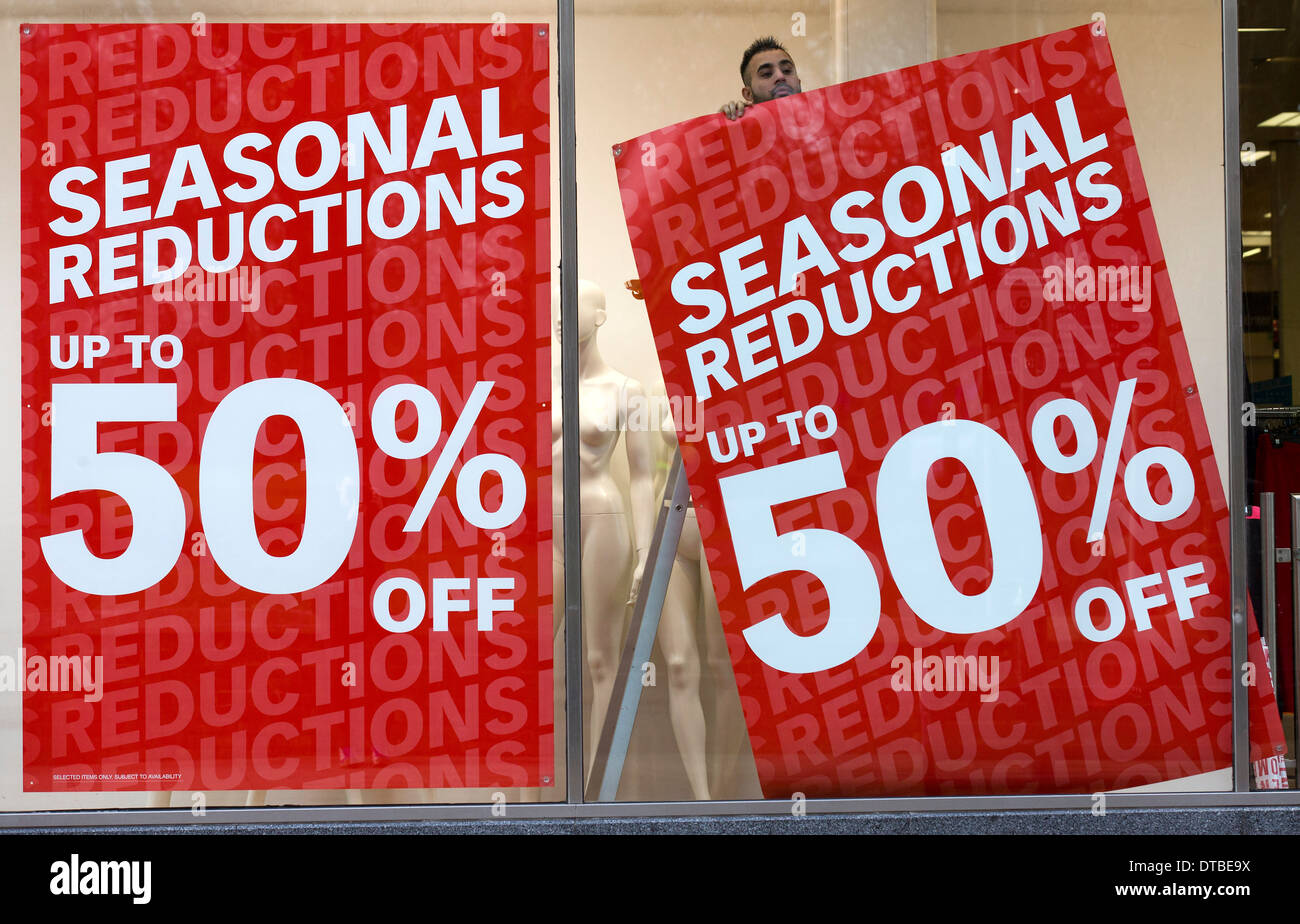 United Kingdom, London : Shop workers adjust "seasonal reductions up to ...