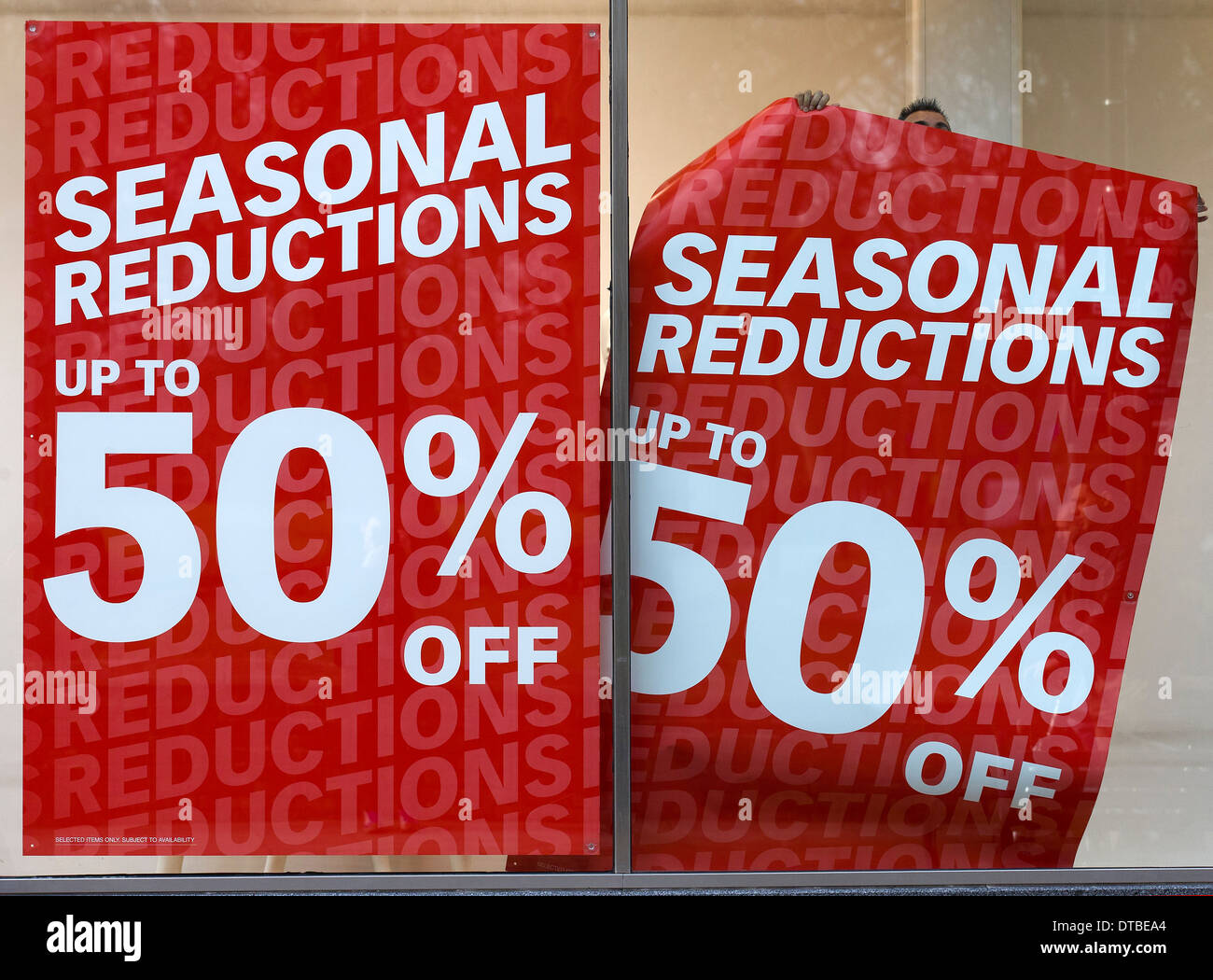 United Kingdom, London : Shop workers adjust "seasonal reductions up to ...