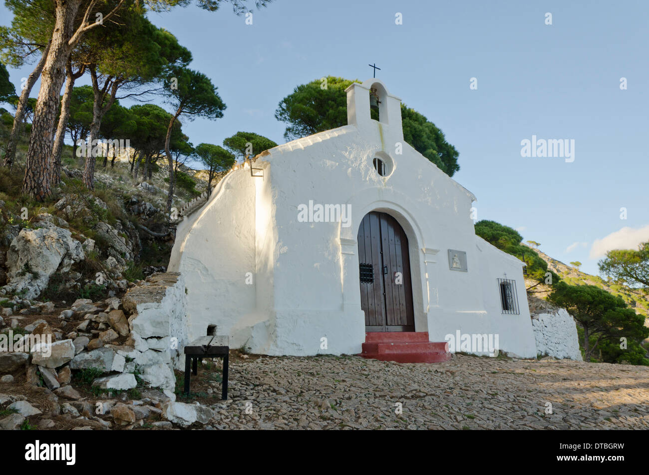 The small chapel of Ermita del Calvario. in the mountains of white ...