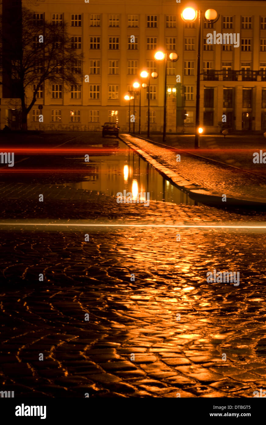 Night city after rain and puddle raflection Stock Photo - Alamy