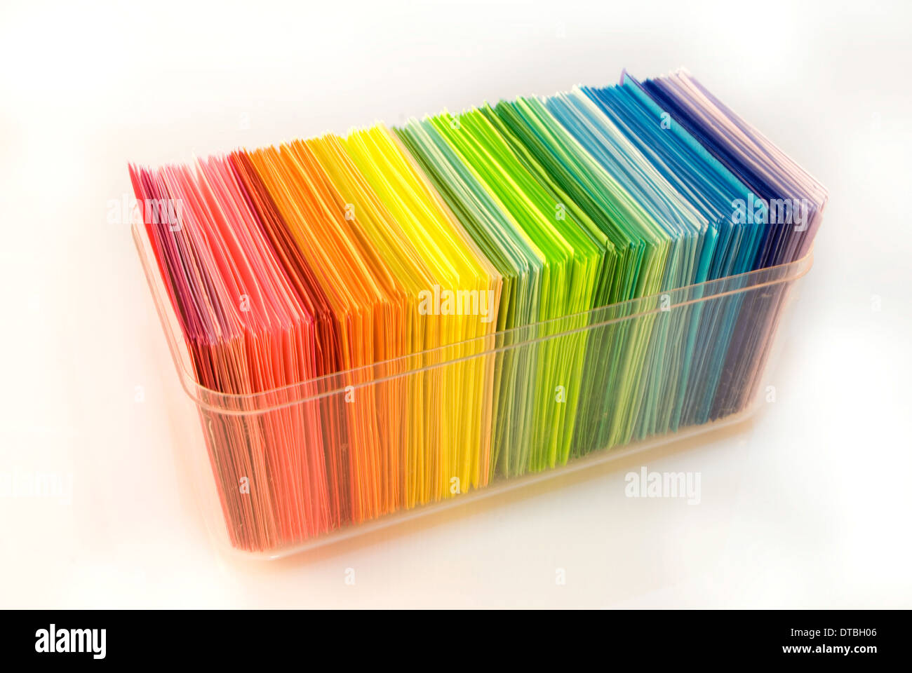 Various color shits of paper stack on white background Stock Photo - Alamy