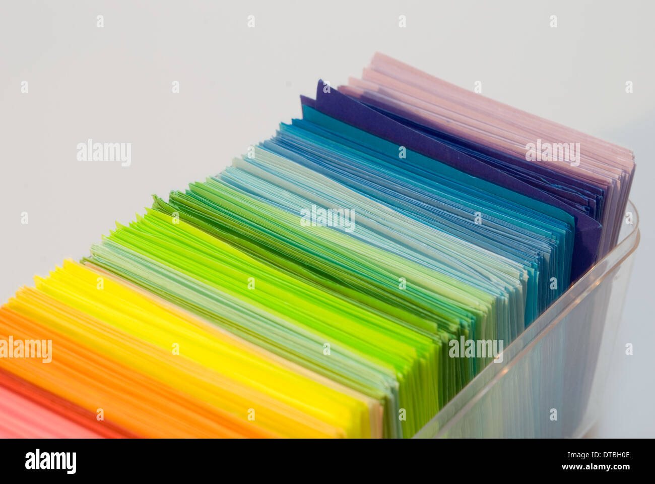 Various color shits of paper scattered on white background Stock Photo ...