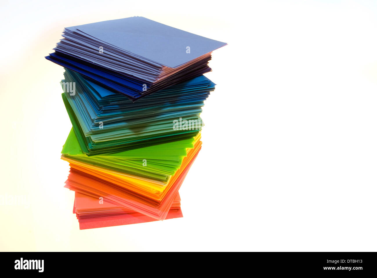 Various color shits of paper scattered on white background Stock Photo ...