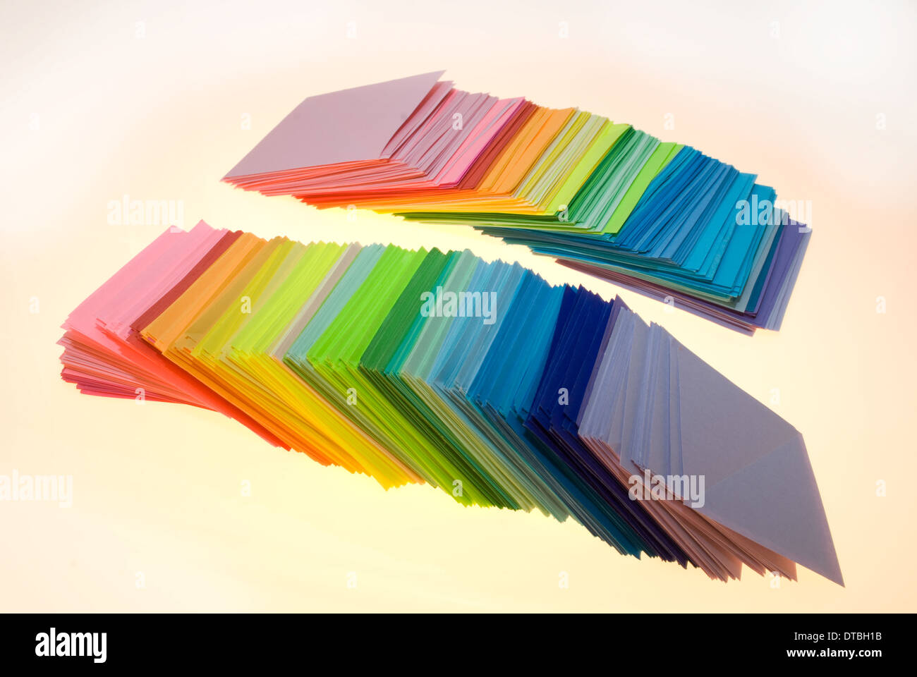 Various color shits of paper scattered on white background Stock Photo ...