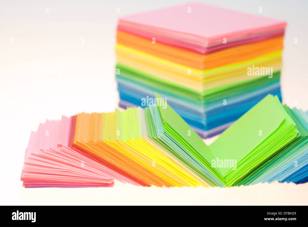 Various color shits of paper scattered on white background Stock Photo ...