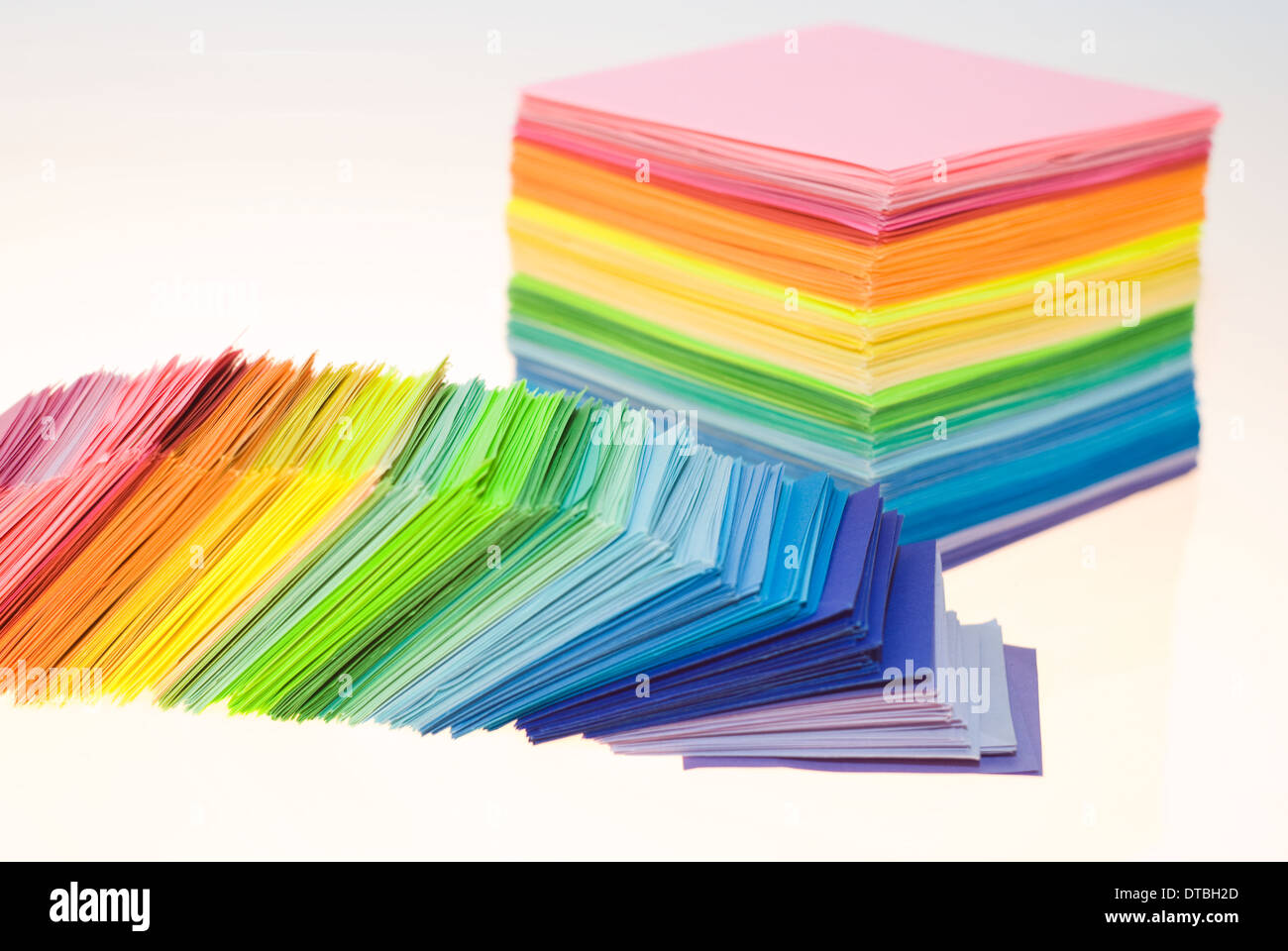 Various color shits of paper scattered on white background Stock Photo ...