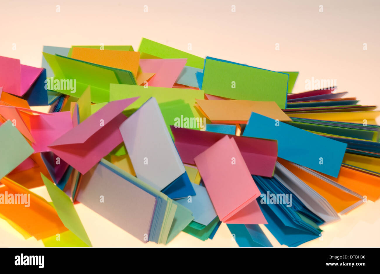 Various color shits of paper scattered on white background Stock Photo ...