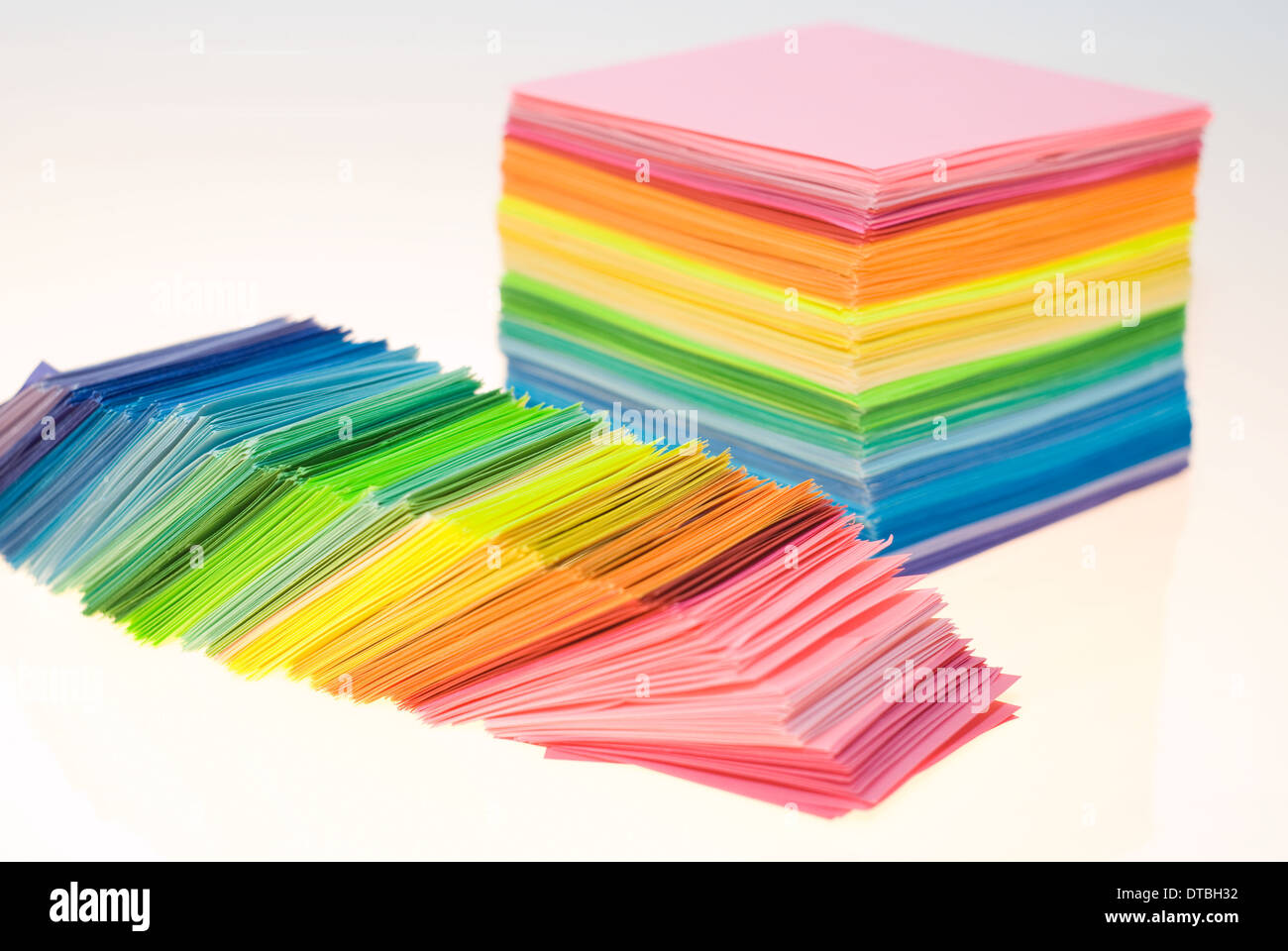 Various color shits of paper scattered on white background Stock Photo ...