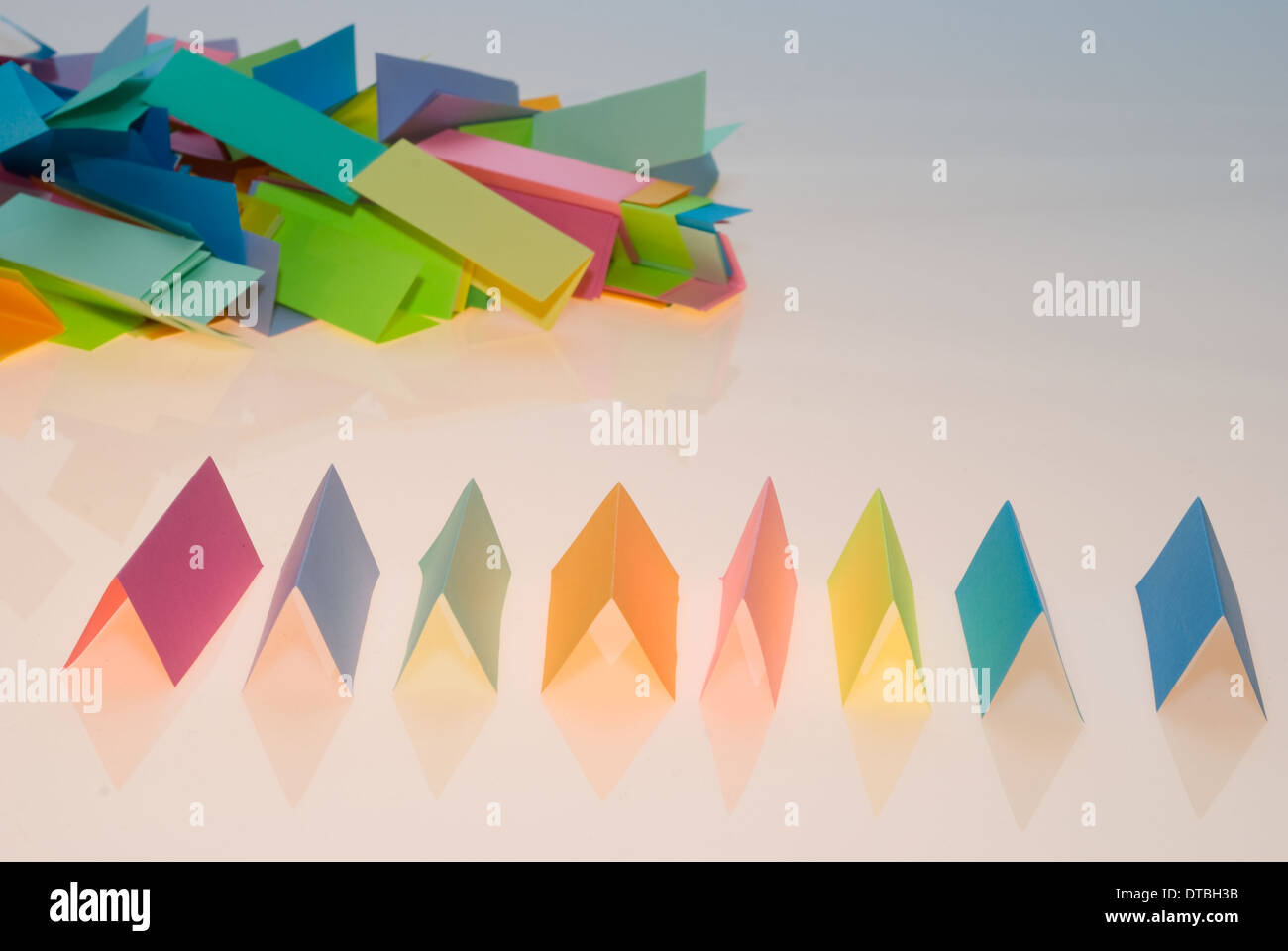 Various color shits of paper scattered on white background Stock Photo ...