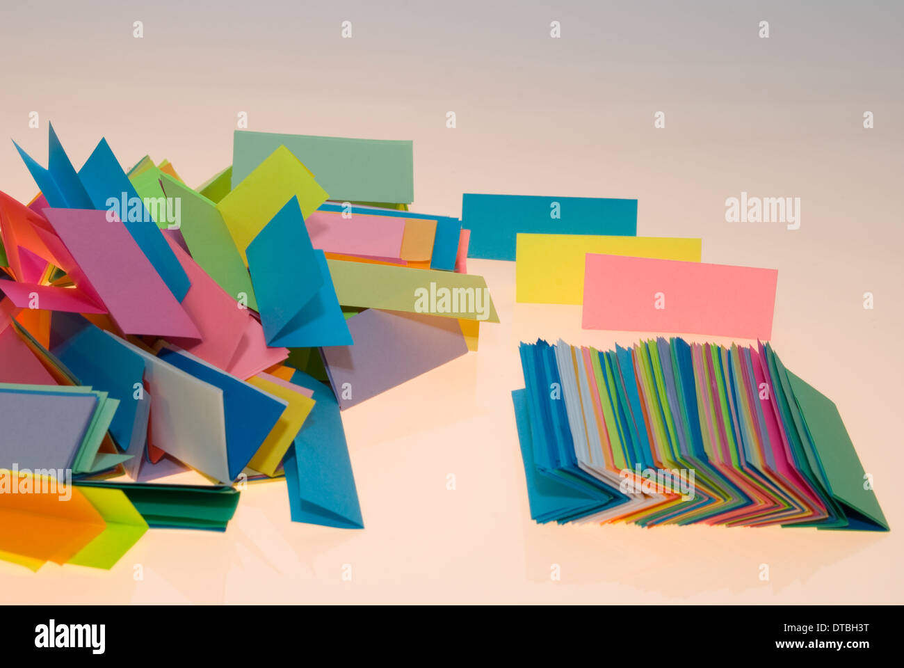 Various color shits of paper scattered on white background Stock Photo ...