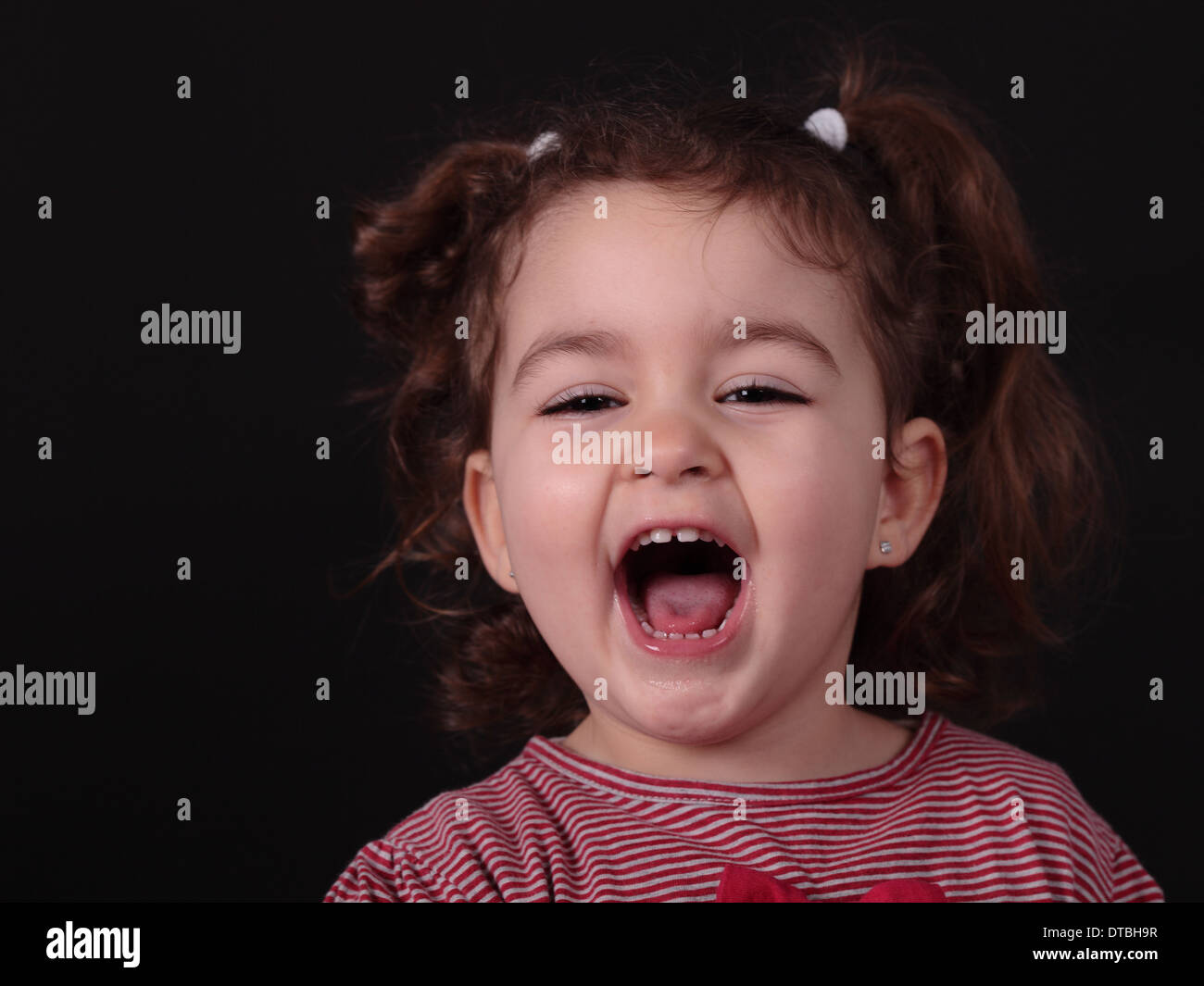 little caucasian girl with a beautiful happy expression Stock Photo - Alamy