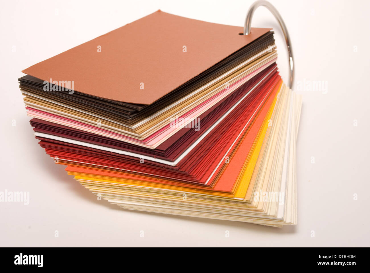 Colored paper stock stand on white background Stock Photo - Alamy