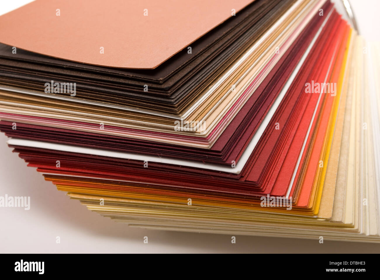 Colored paper stock stand on white background Stock Photo - Alamy