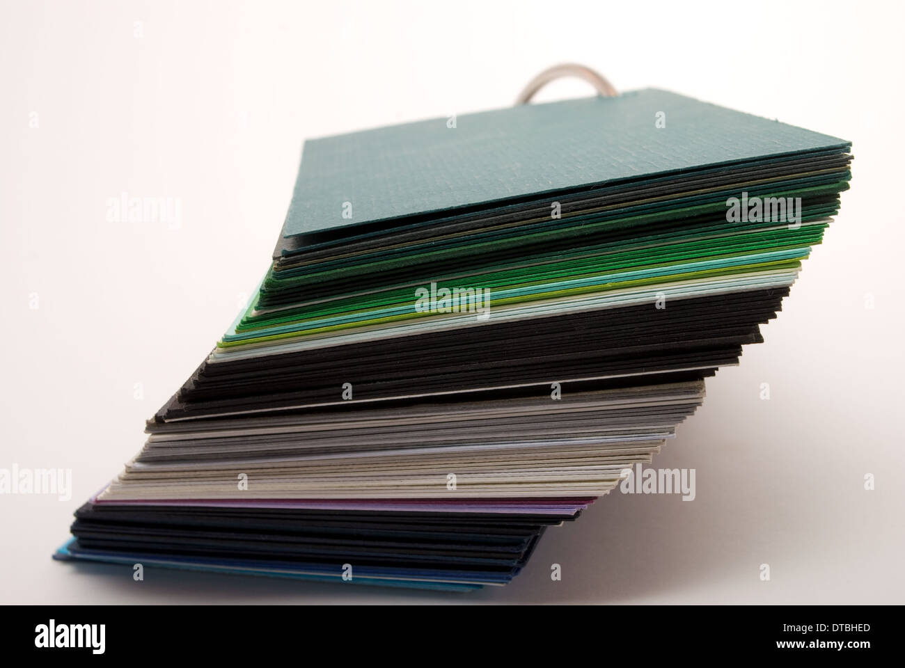 Colored paper stock stand on white background Stock Photo - Alamy