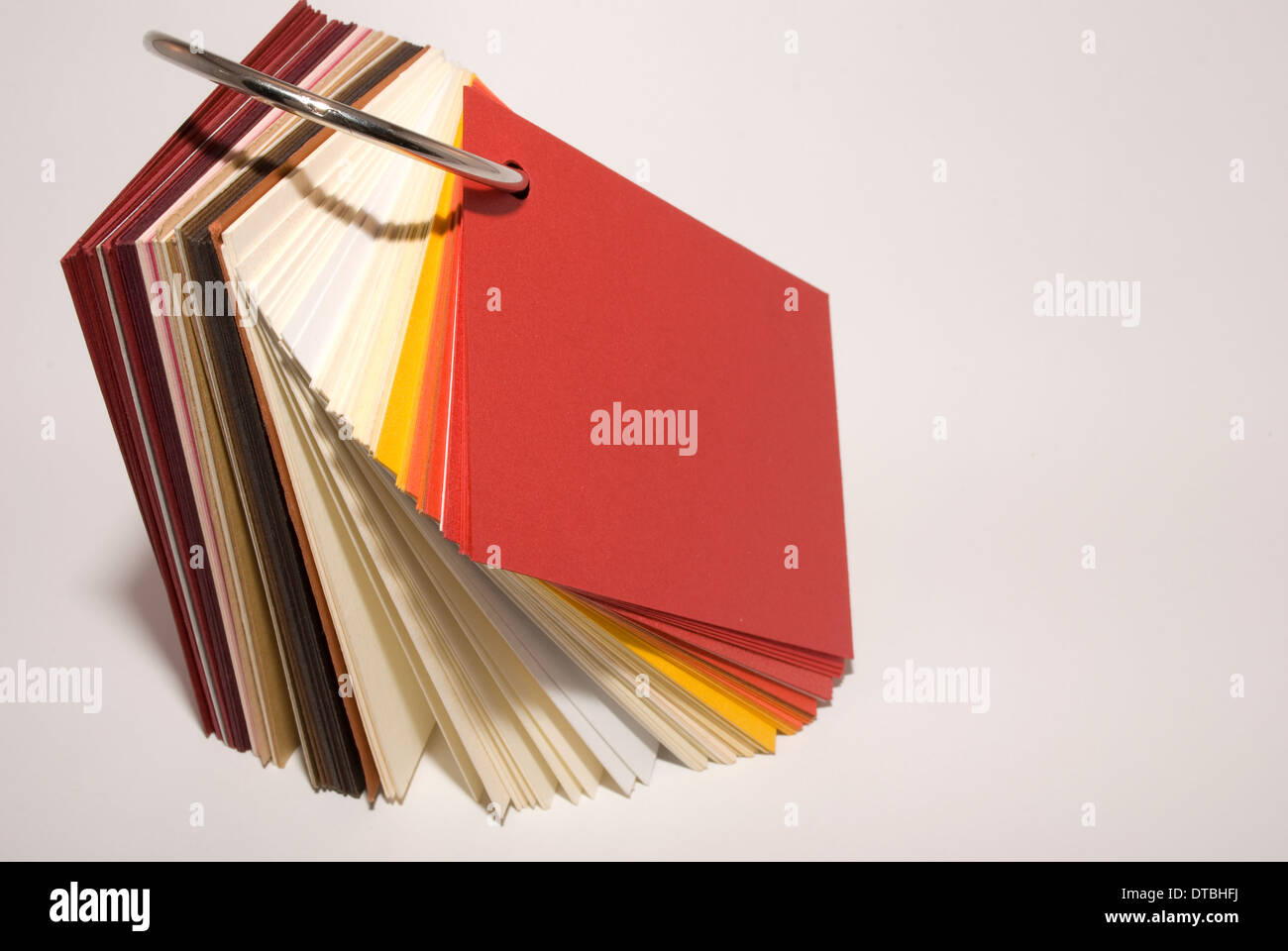 Colored paper stock stand on white background Stock Photo - Alamy