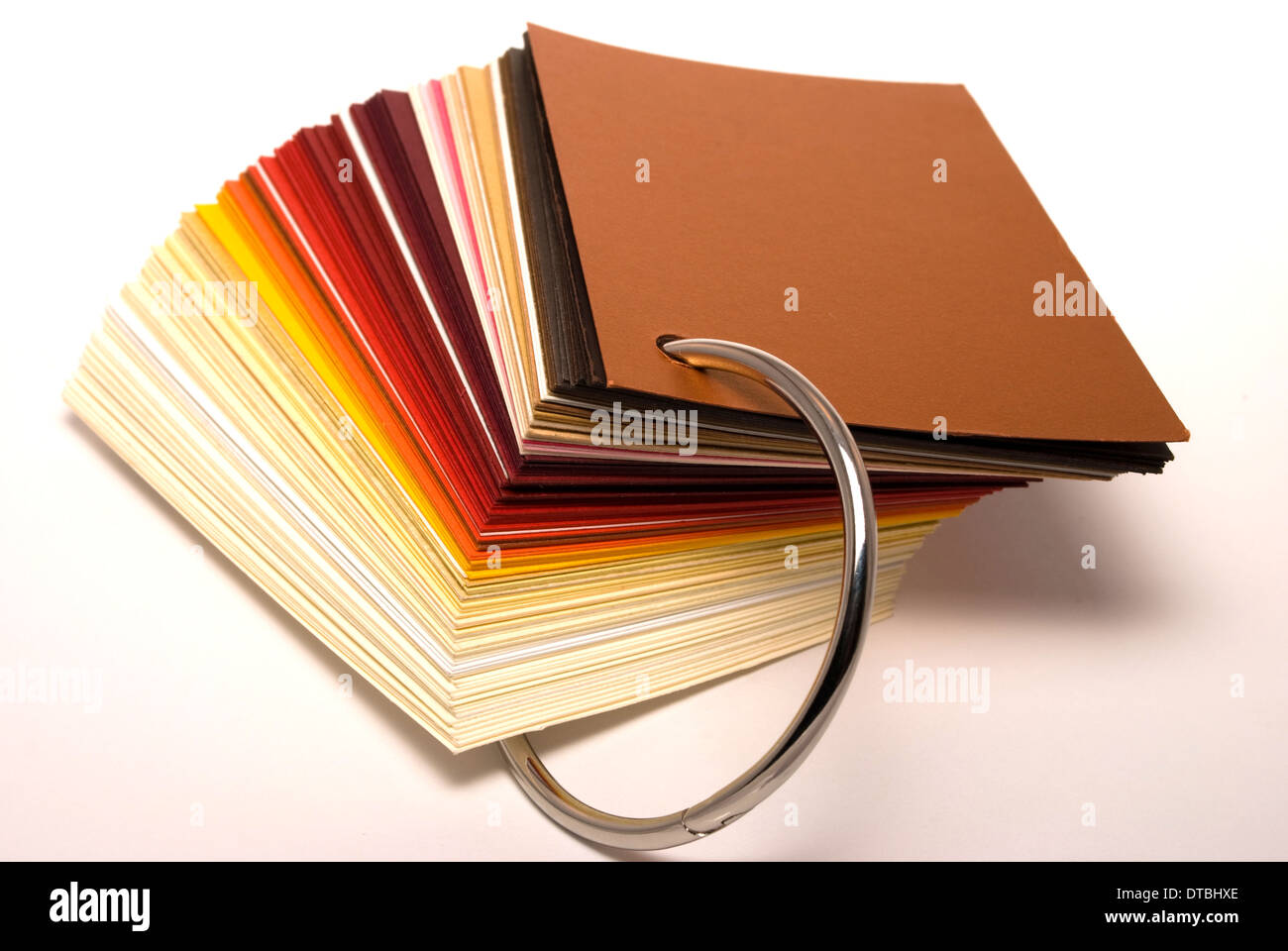 Colored paper stock stand on white background Stock Photo - Alamy